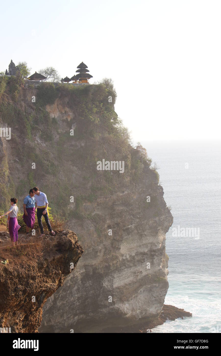 crazy people standing in a piece of rock Stock Photo - Alamy