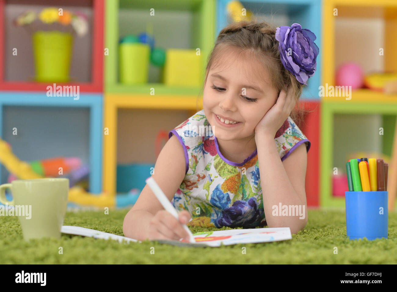 Little girl drawing at class Stock Photo - Alamy