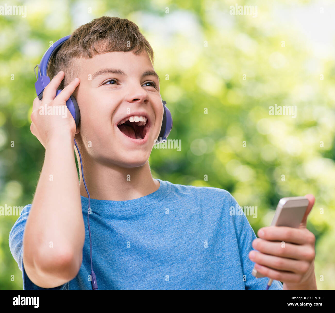 Happy boy child smartphone earphones hi-res stock photography and ...