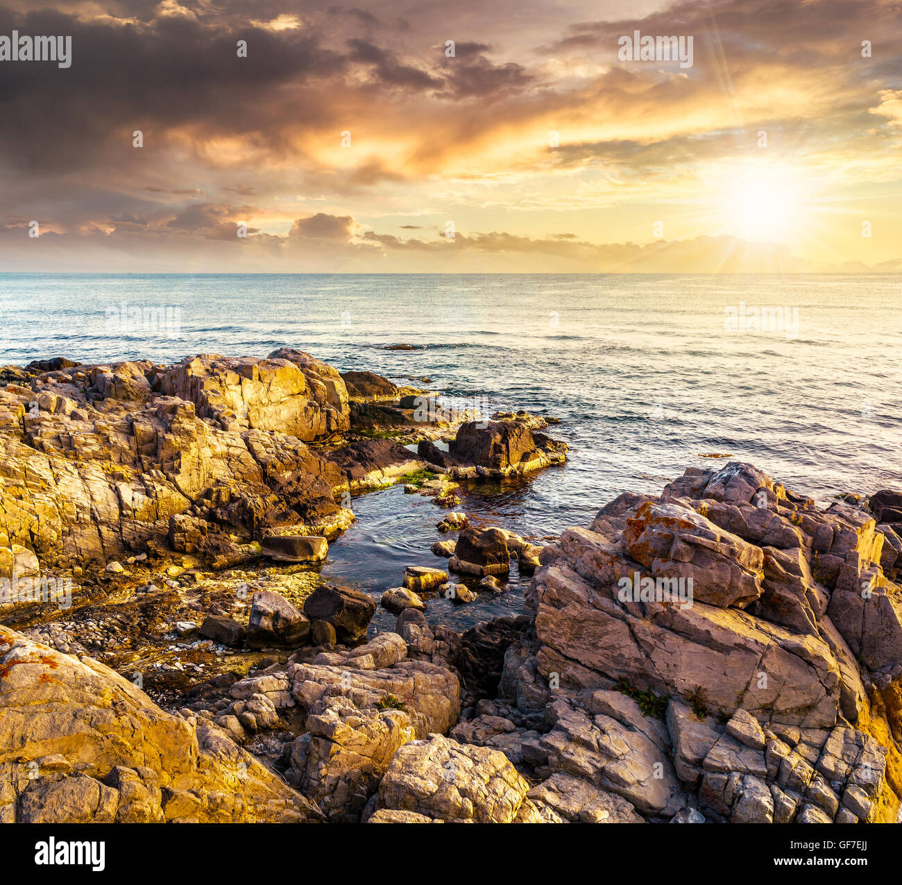 calm sea landscape with some wave near rocky coast with boulders and ...