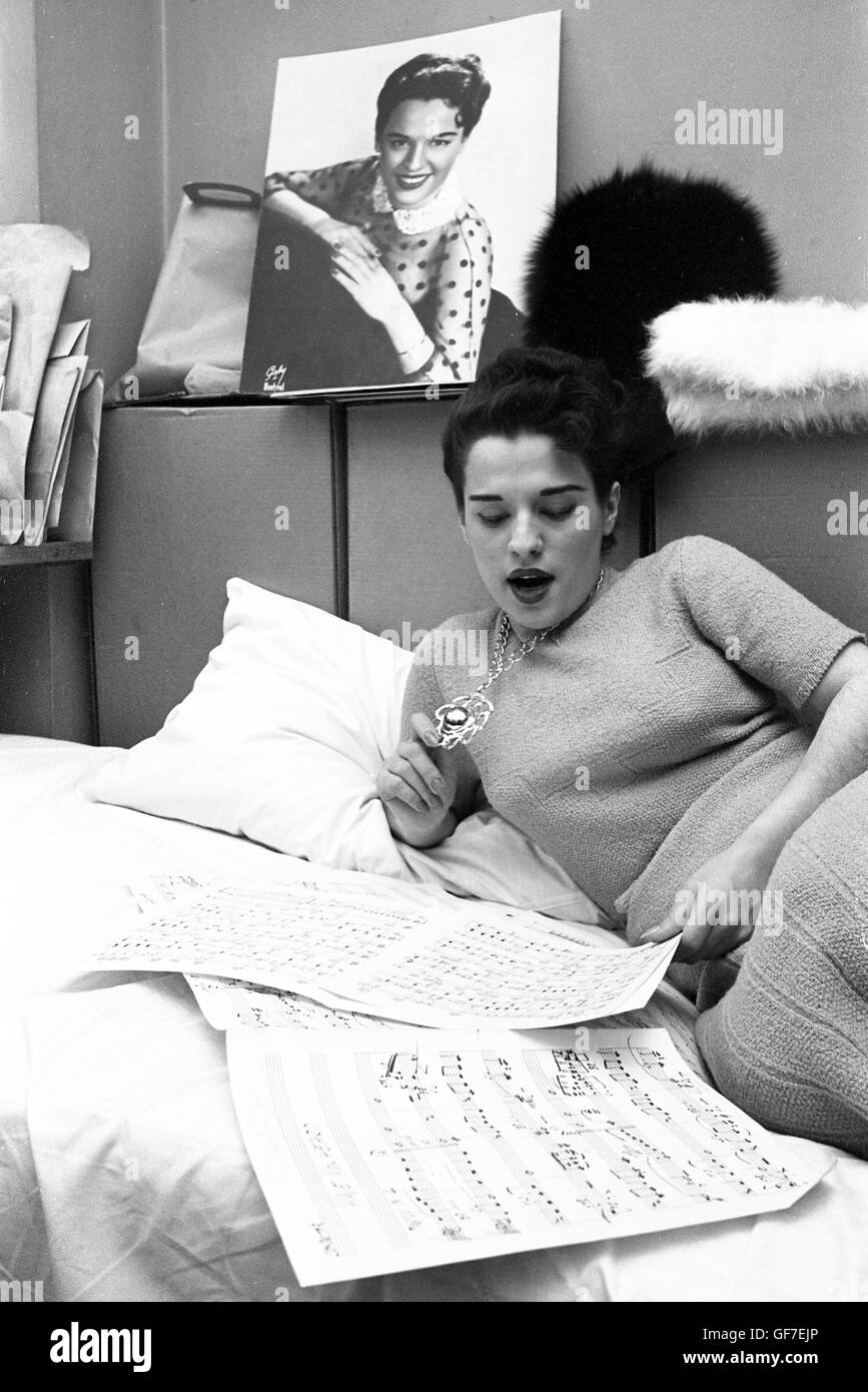 Singer Joni James, studying a musical score, 1953 Stock Photo - Alamy