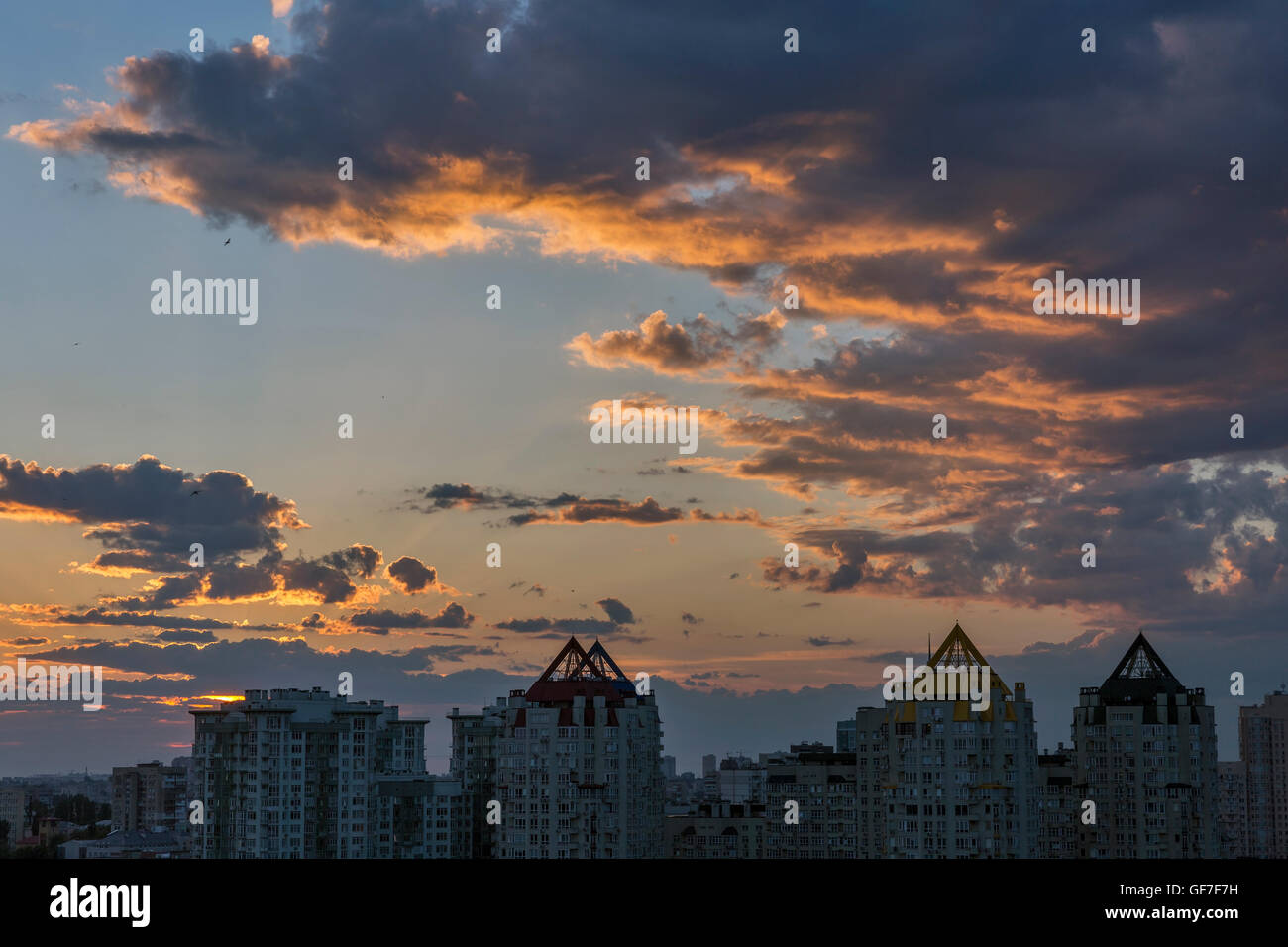 Urban dramatic sunset with clouds over residential buildings. HDR Stock ...