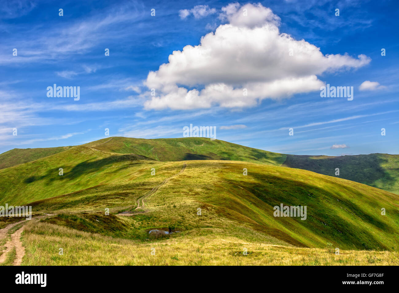 mountain landscape. travers path through hill side to the mountain top ...