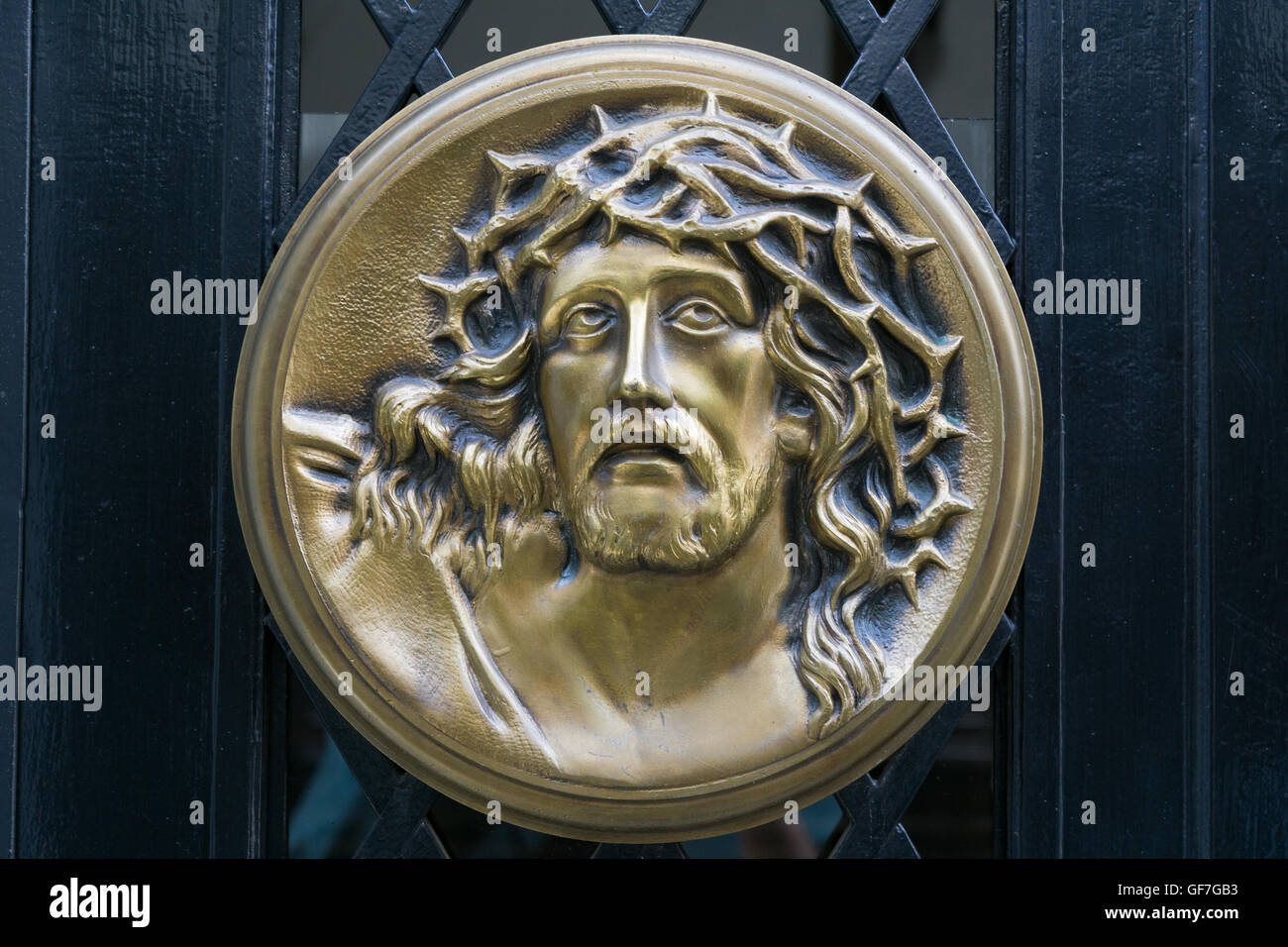Jesus carved figure in metal Stock Photo - Alamy