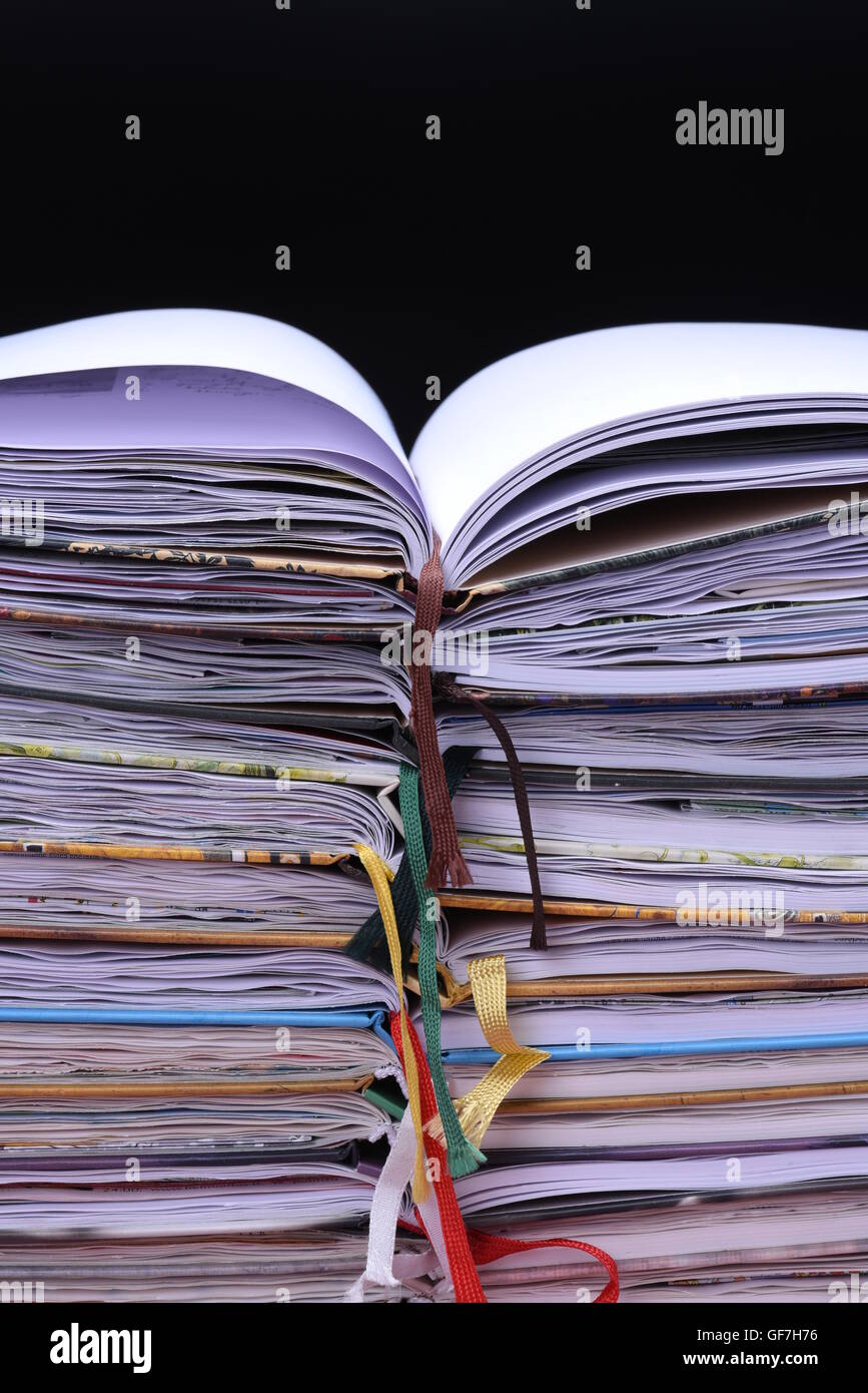 Stack of notebooks, work for teacher Stock Photo - Alamy