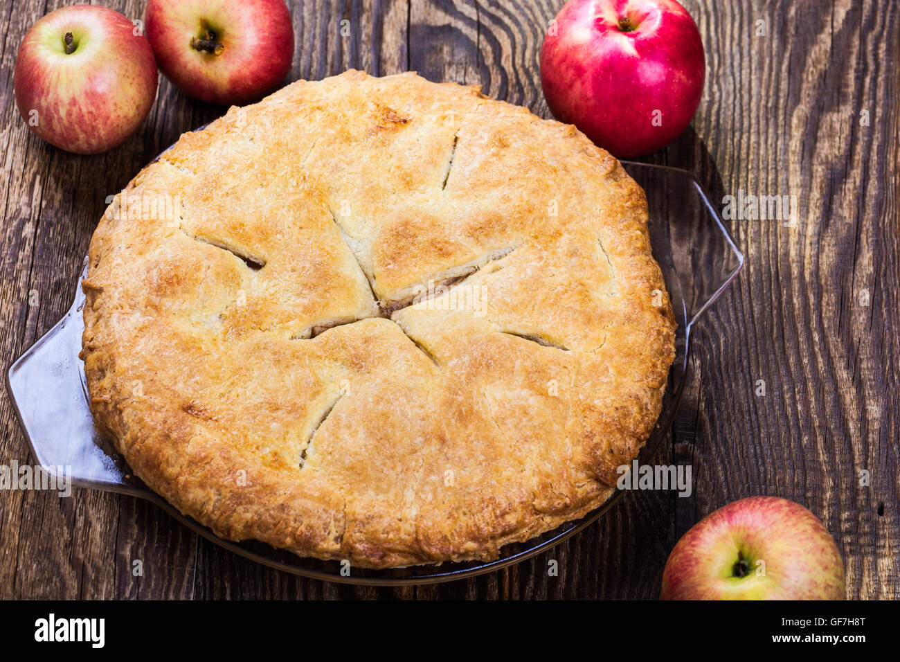 Homemade apple pie with a flaky pie crust and sliced apples, sugar, allspice, cinnamon, vanilla ...