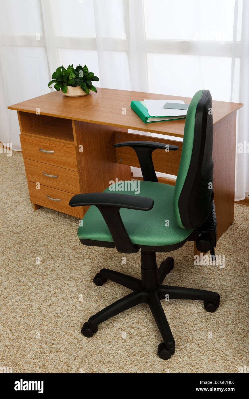 desk with drawers and a chair in a modern office Stock Photo - Alamy