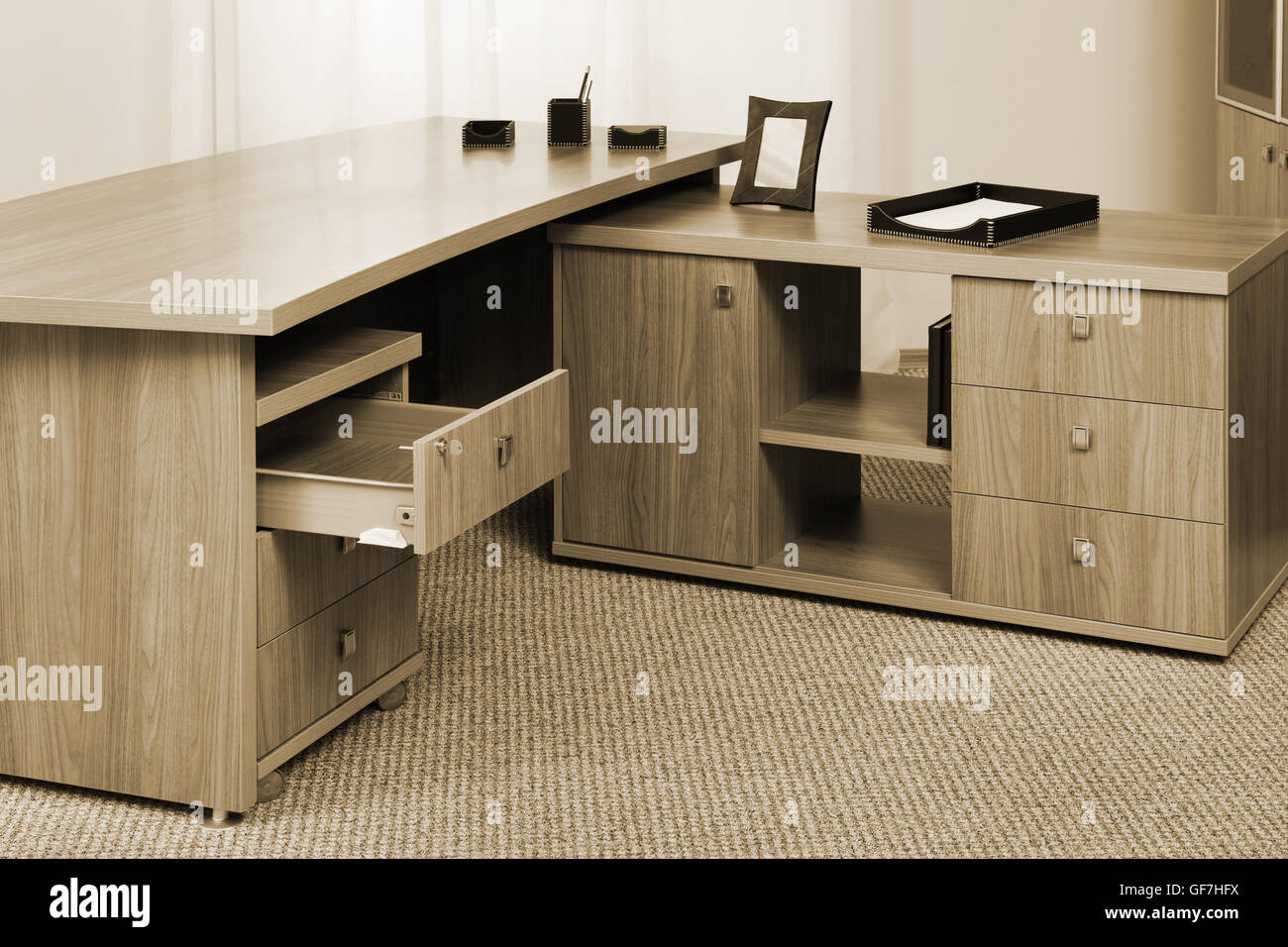 wooden desk with an open drawer in the office Stock Photo - Alamy