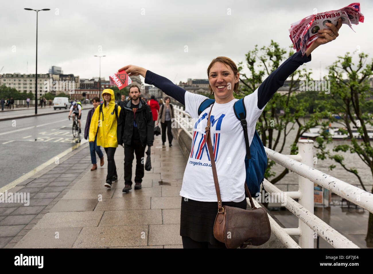 A woman handing out brochures with information to Remain in the EU ...