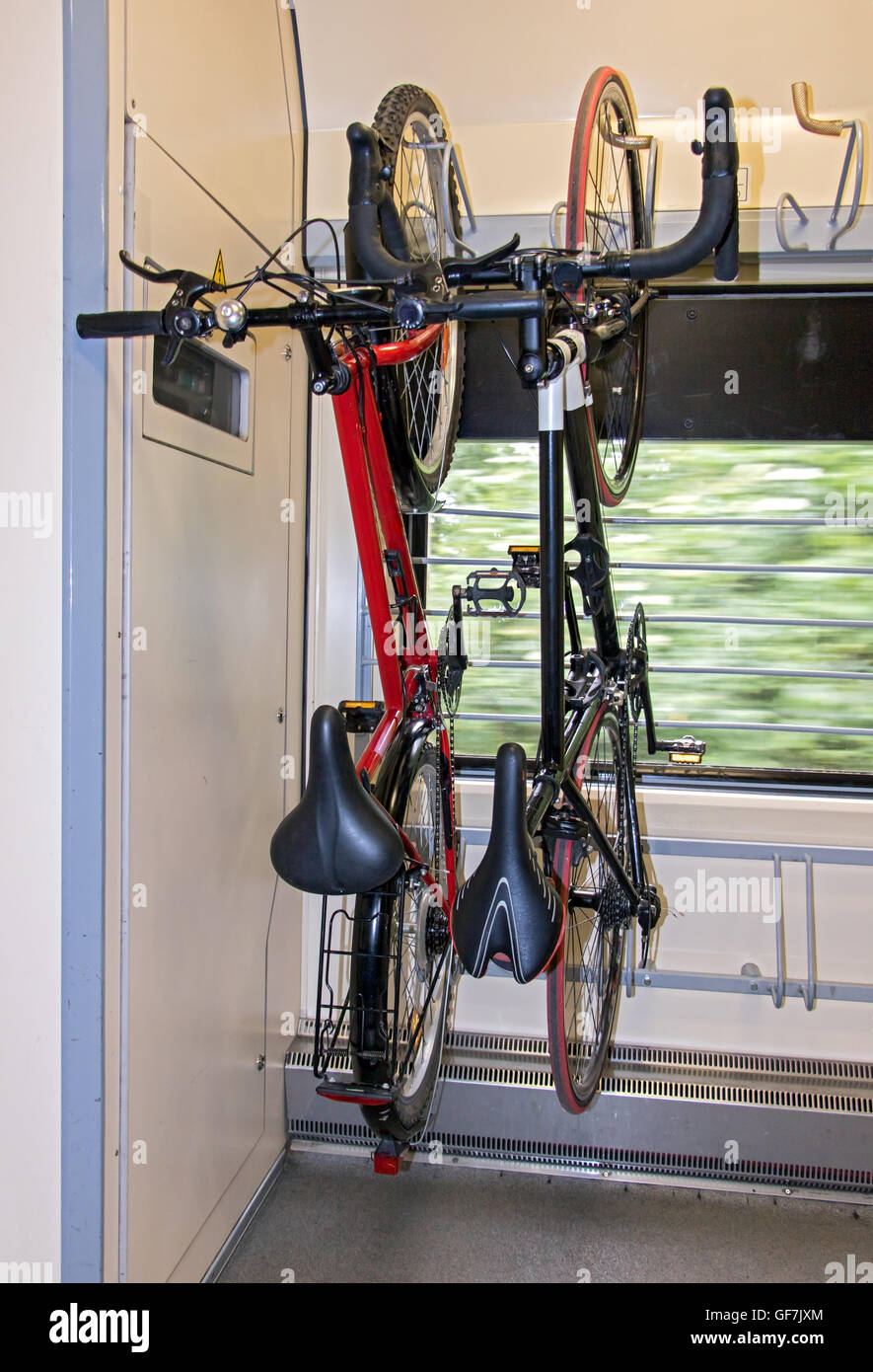 Bike hanging on the rack in the train. Transport bicycles in the wagon ...