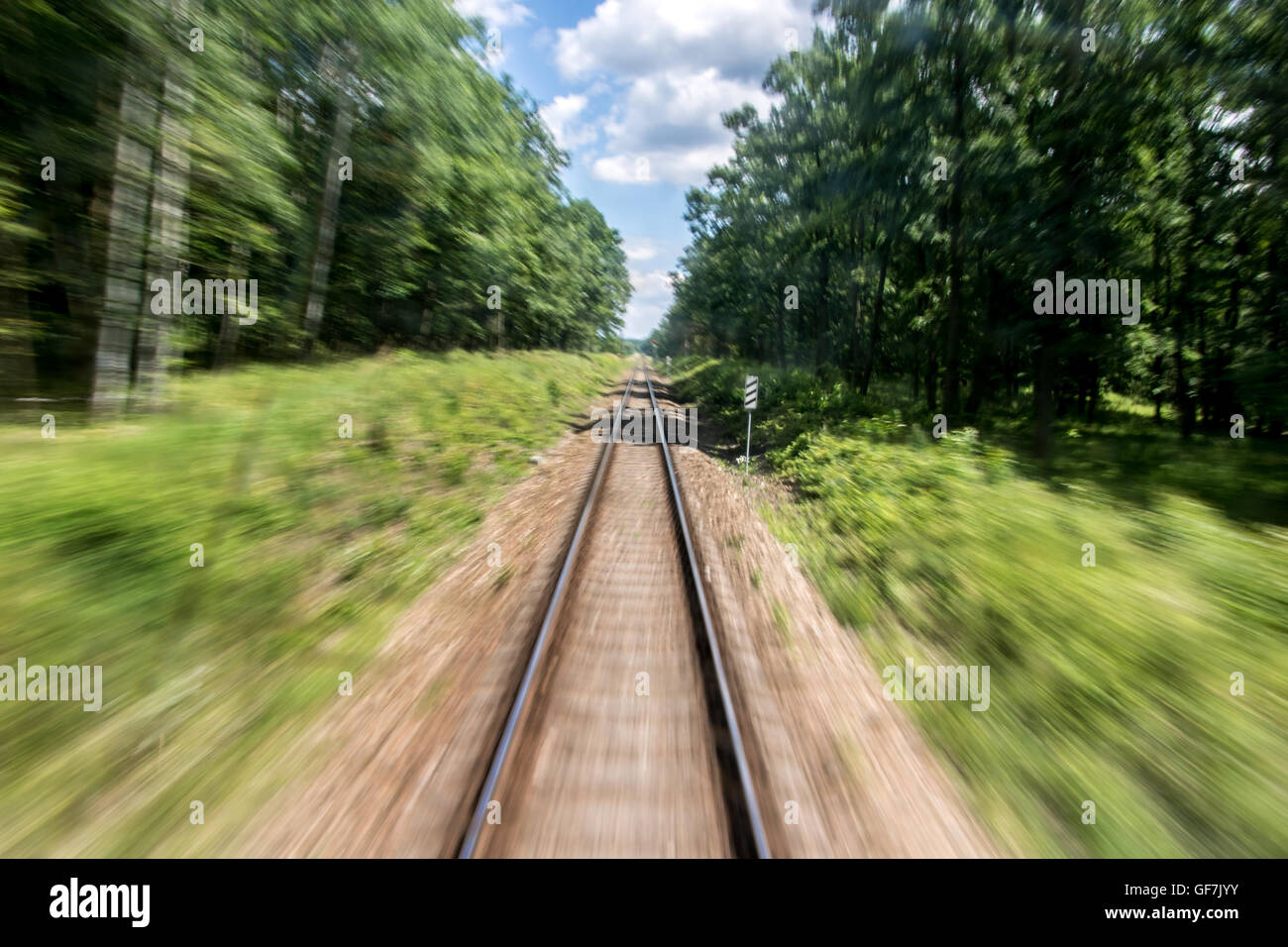 Blurred railroad tracks in summer nature behind a passing train Stock ...