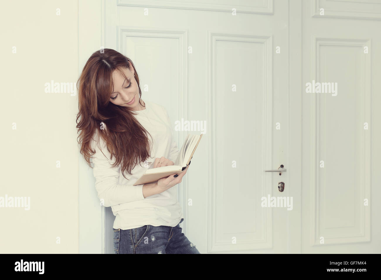 Girl with book Stock Photo - Alamy