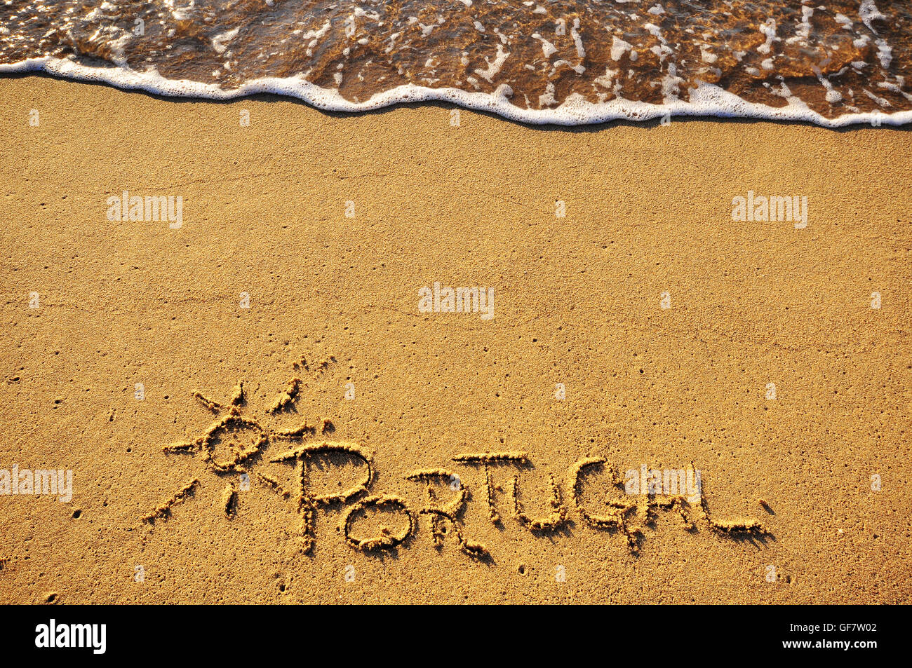 Portugal sign on the sand beach Stock Photo - Alamy