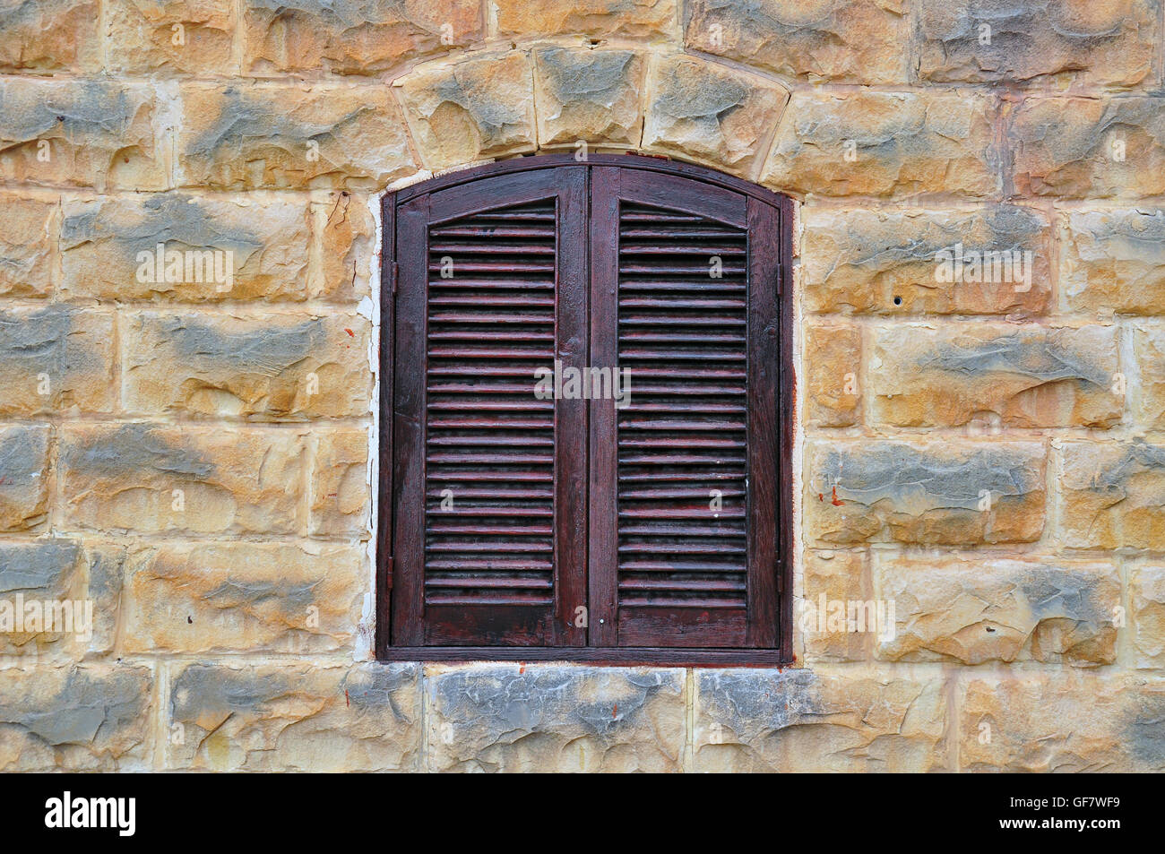 Closed windows with shutters in old house Stock Photo - Alamy