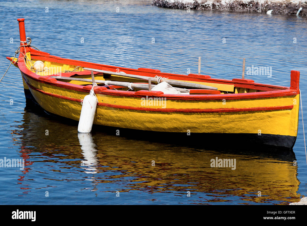 typical Sicilian fishing boat, anchored in the sea Stock Photo - Alamy