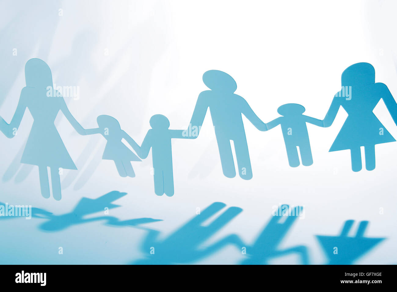 Family paper chain cutout holding hands Stock Photo - Alamy