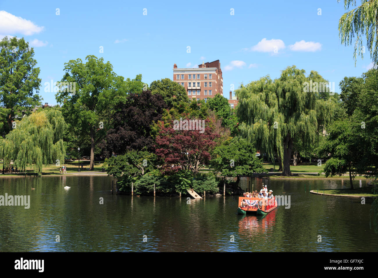 A photograph of the lake and a tourist boat in the Public Garden in ...