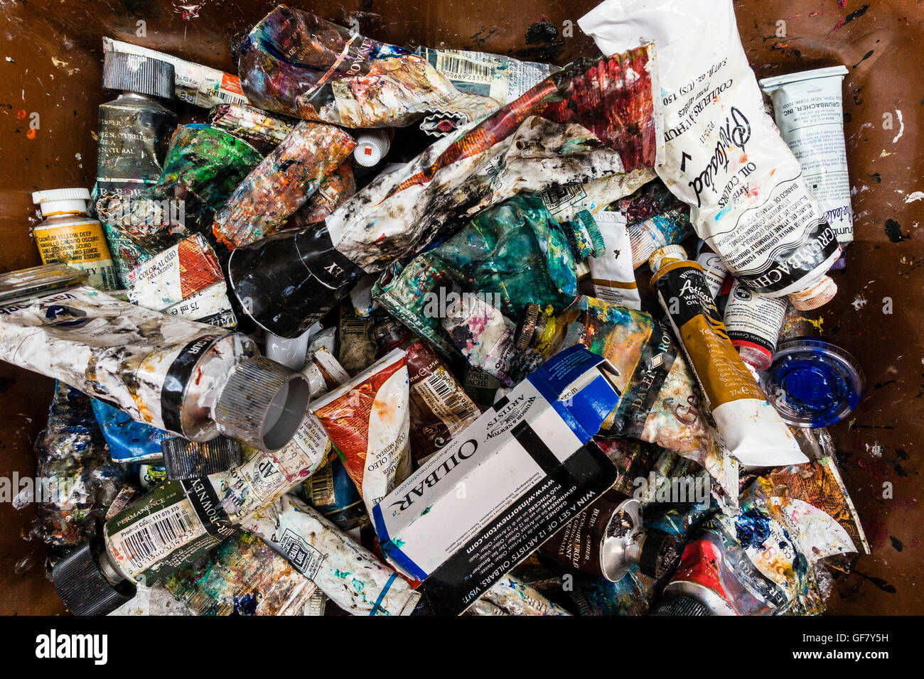 Close up of a pile of tubes of oil color paints, crumpled and squished ...