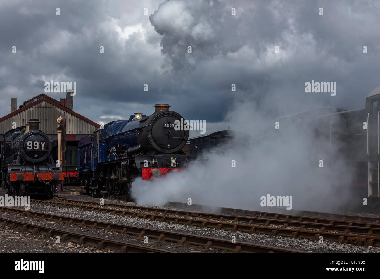 Restored steam locomotive King Edward II emits steam on the tracks at ...