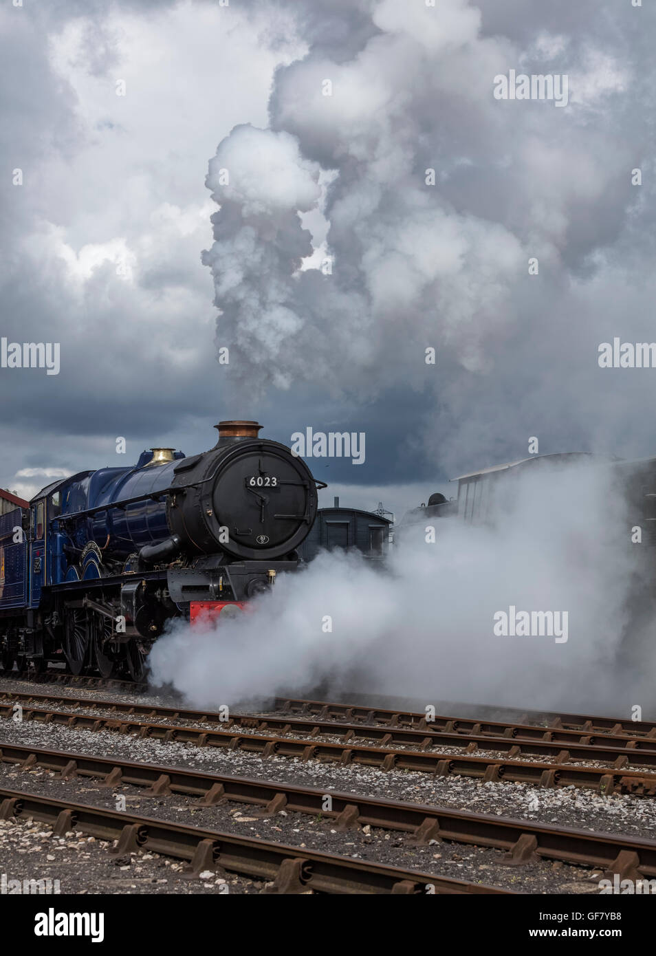 King Edward II restored steam train with steam coming out of wheels and ...