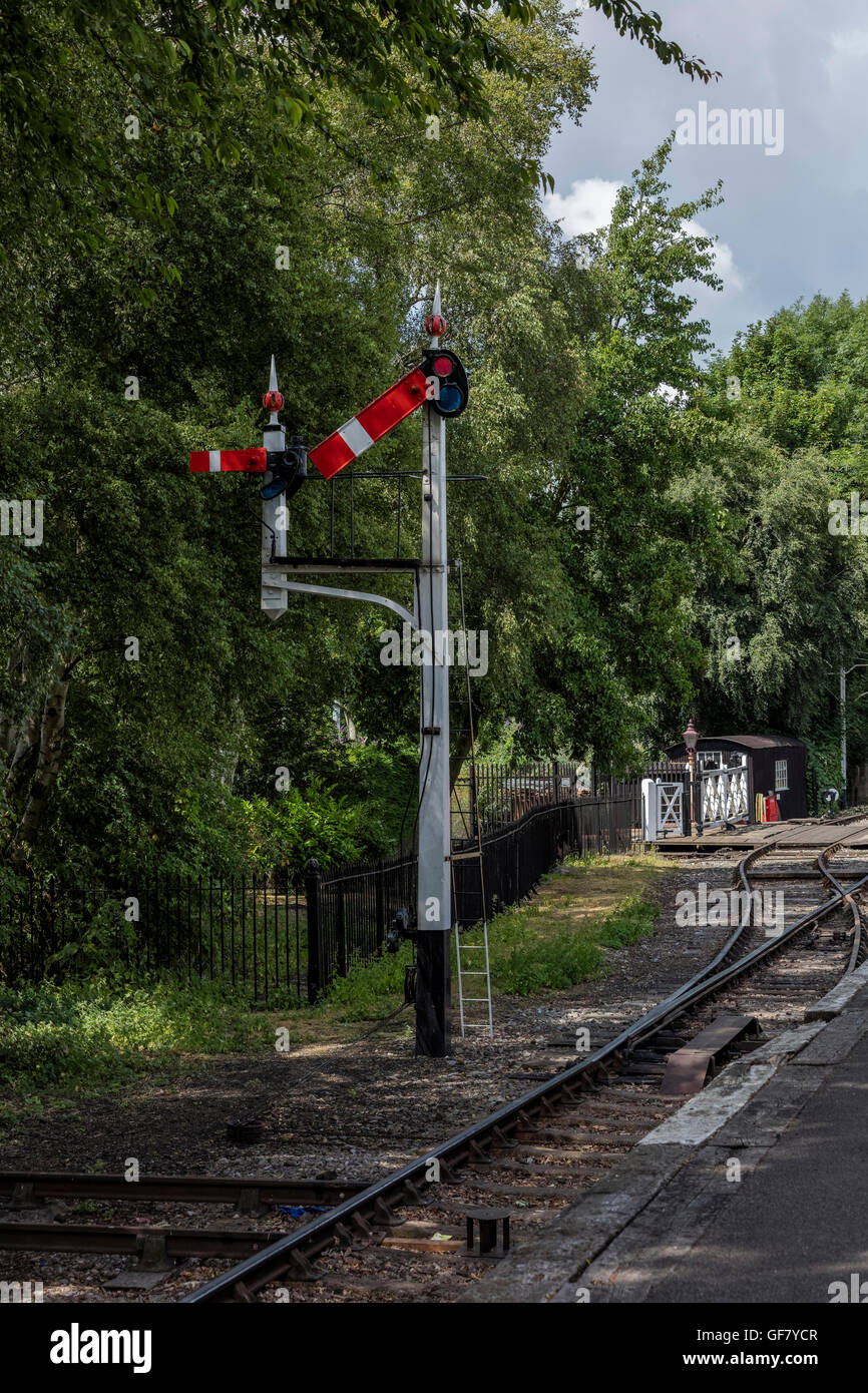 Signals and a level crossing with a railway track at the Didcot Railway ...
