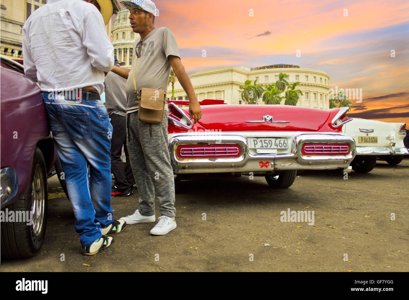 Taxi drivers talk by their classic cars in downtown Havana Cuba Stock ...
