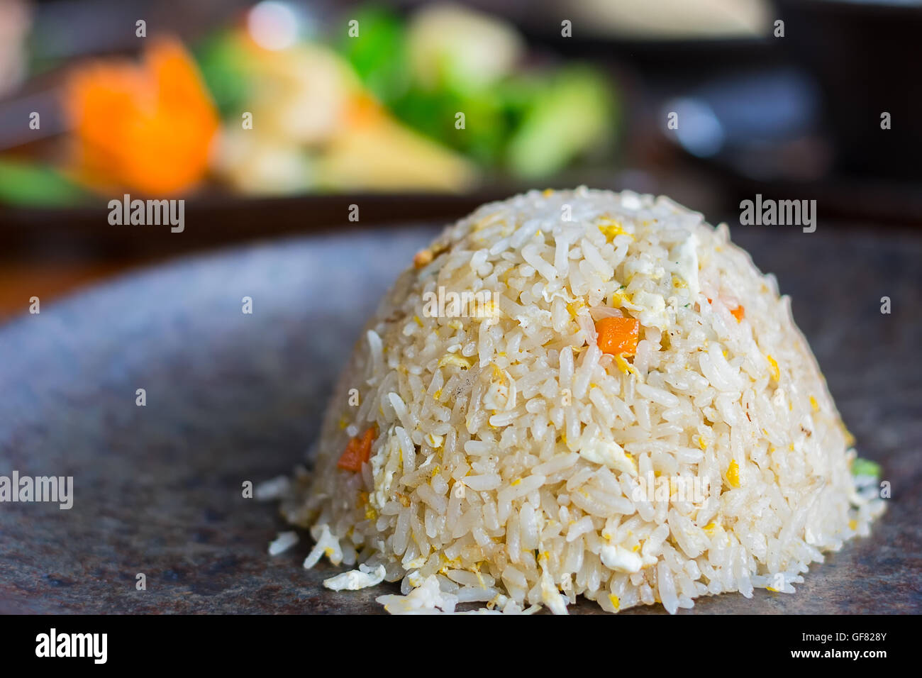 The side view of fried rice with thaifood background Stock Photo - Alamy