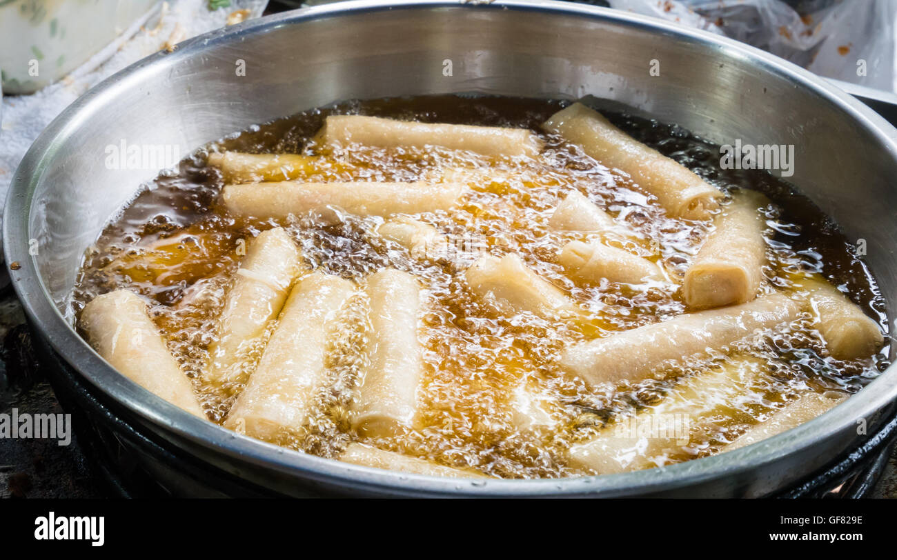 Deep fried spring rolls in the pan Stock Photo - Alamy