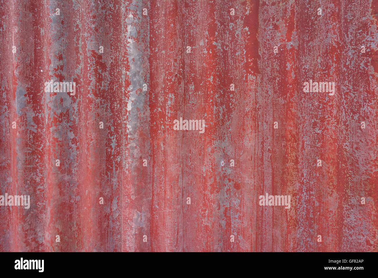 Red stamping zinc wall,texture background Stock Photo - Alamy