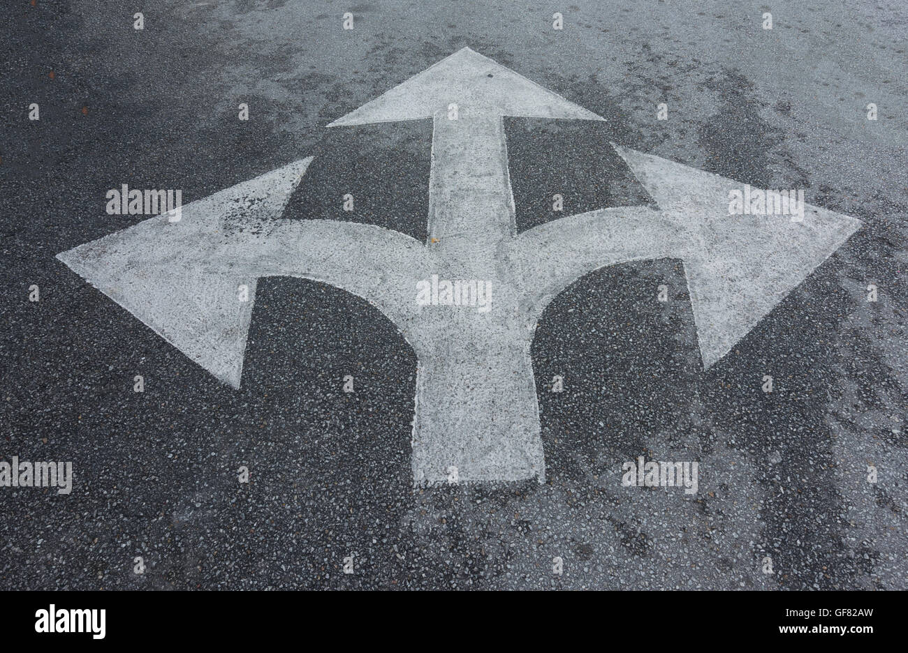 three way Arrow signs on the road Stock Photo - Alamy