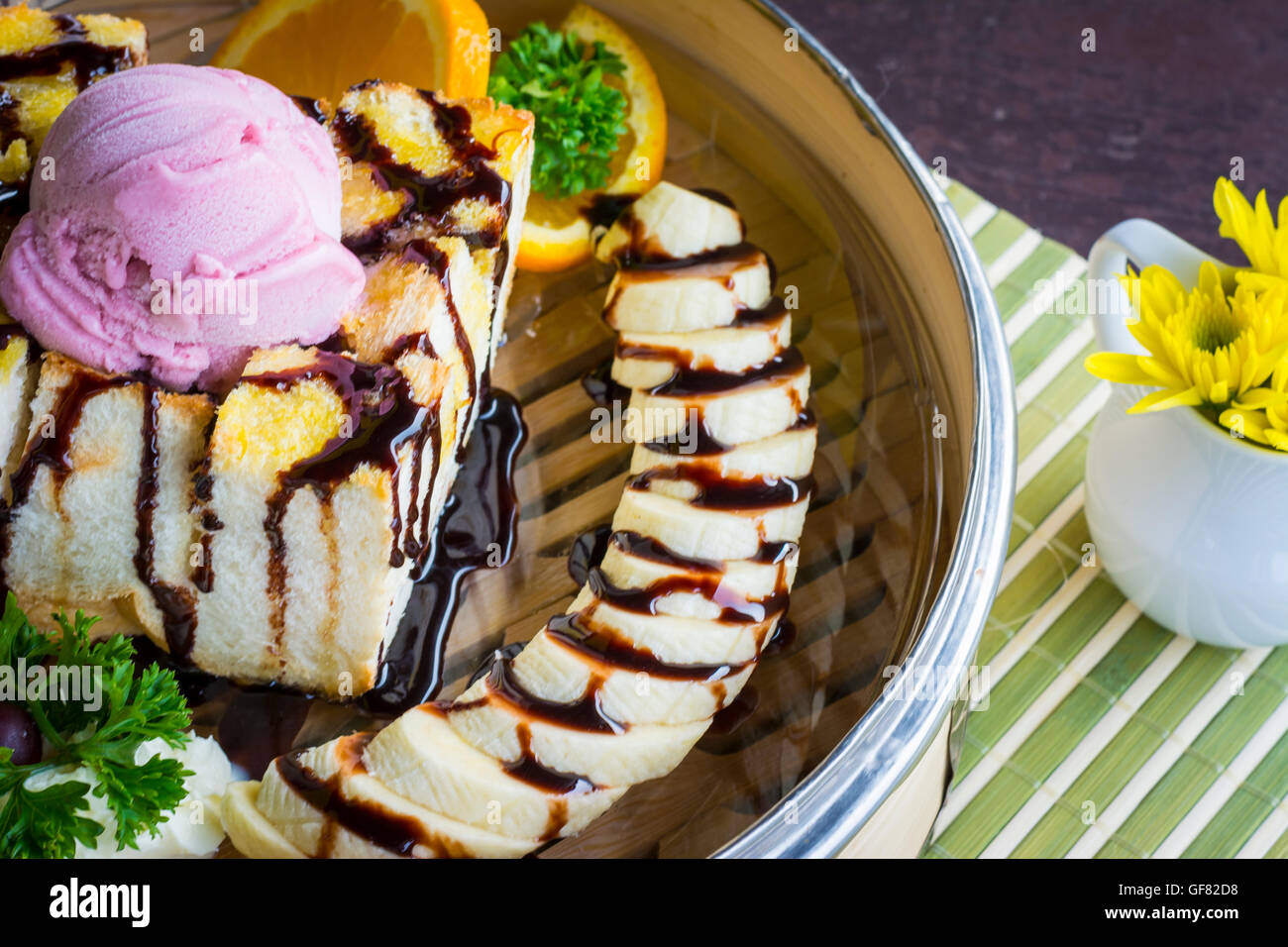 Honey toast and banana wtih dry ice on table background Stock Photo - Alamy