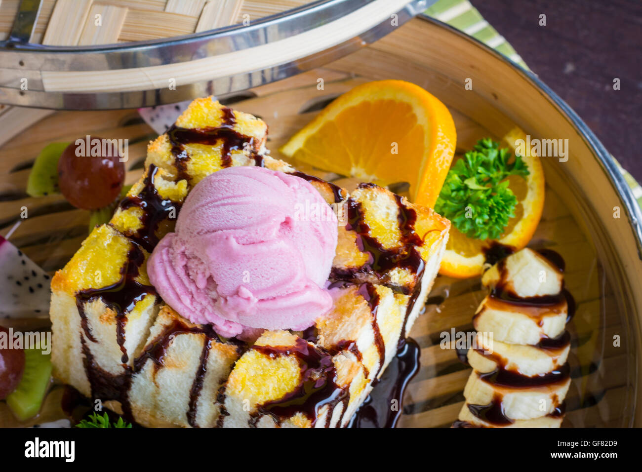Honey toast and banana wtih dry ice on table background Stock Photo - Alamy