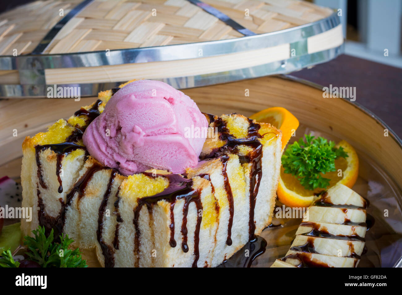Honey toast and banana wtih dry ice on table background Stock Photo - Alamy