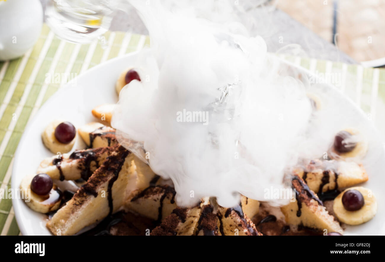 Honey toast and banana wtih dry ice on table background Stock Photo - Alamy