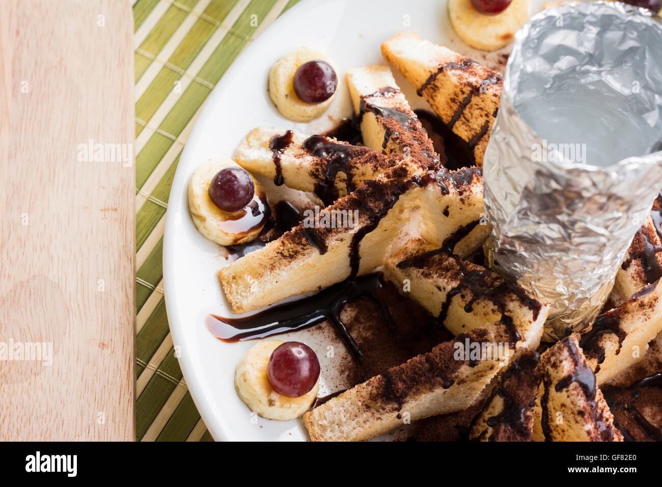Honey toast and banana wtih dry ice on table background Stock Photo - Alamy