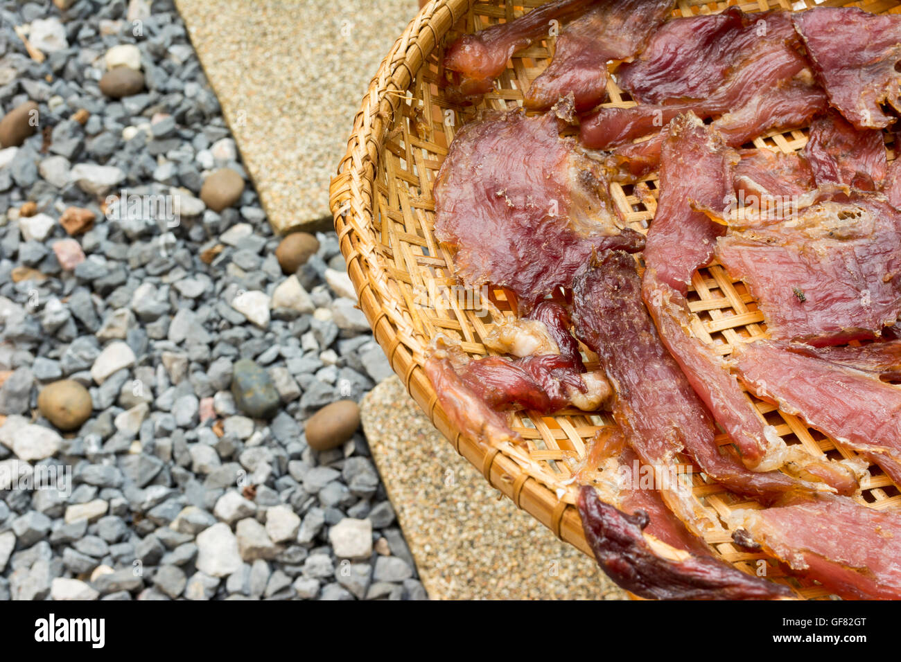 Sun dried beef on the threshing basket Stock Photo - Alamy