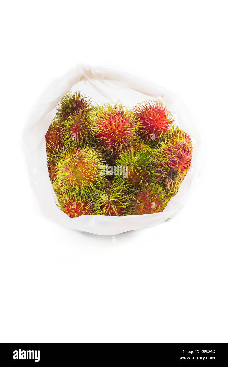 Rambutan Fruit with plastic bag on white background Stock Photo - Alamy