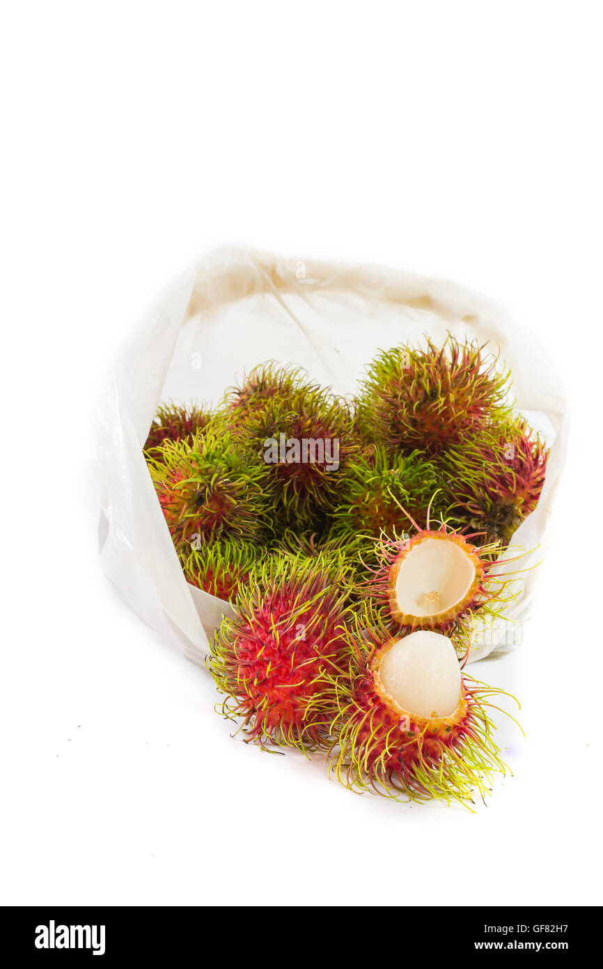 Rambutan Fruit with plastic bag on white background Stock Photo - Alamy