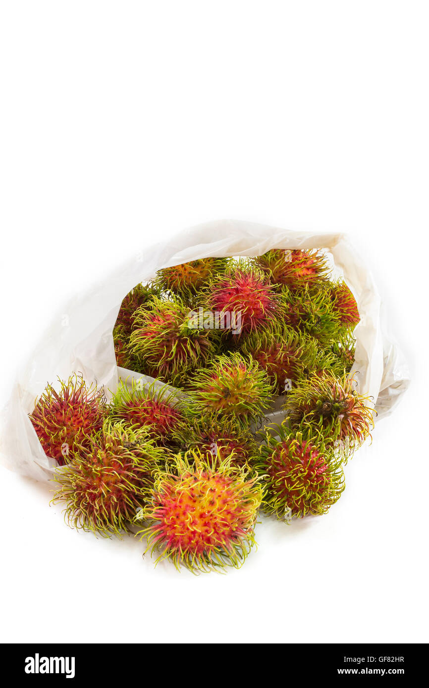 Rambutan Fruit with plastic bag on white background Stock Photo - Alamy