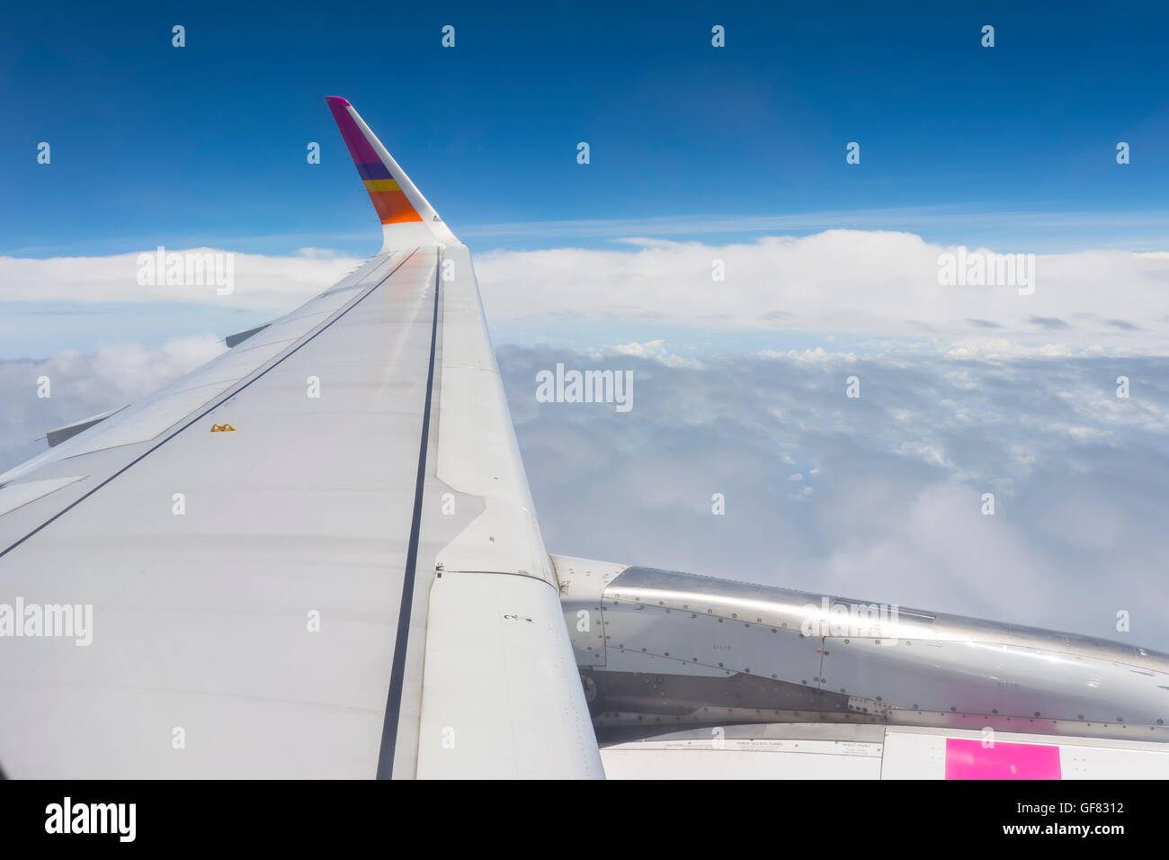 The wings of the plane, and the beautiful view from the glass window of ...