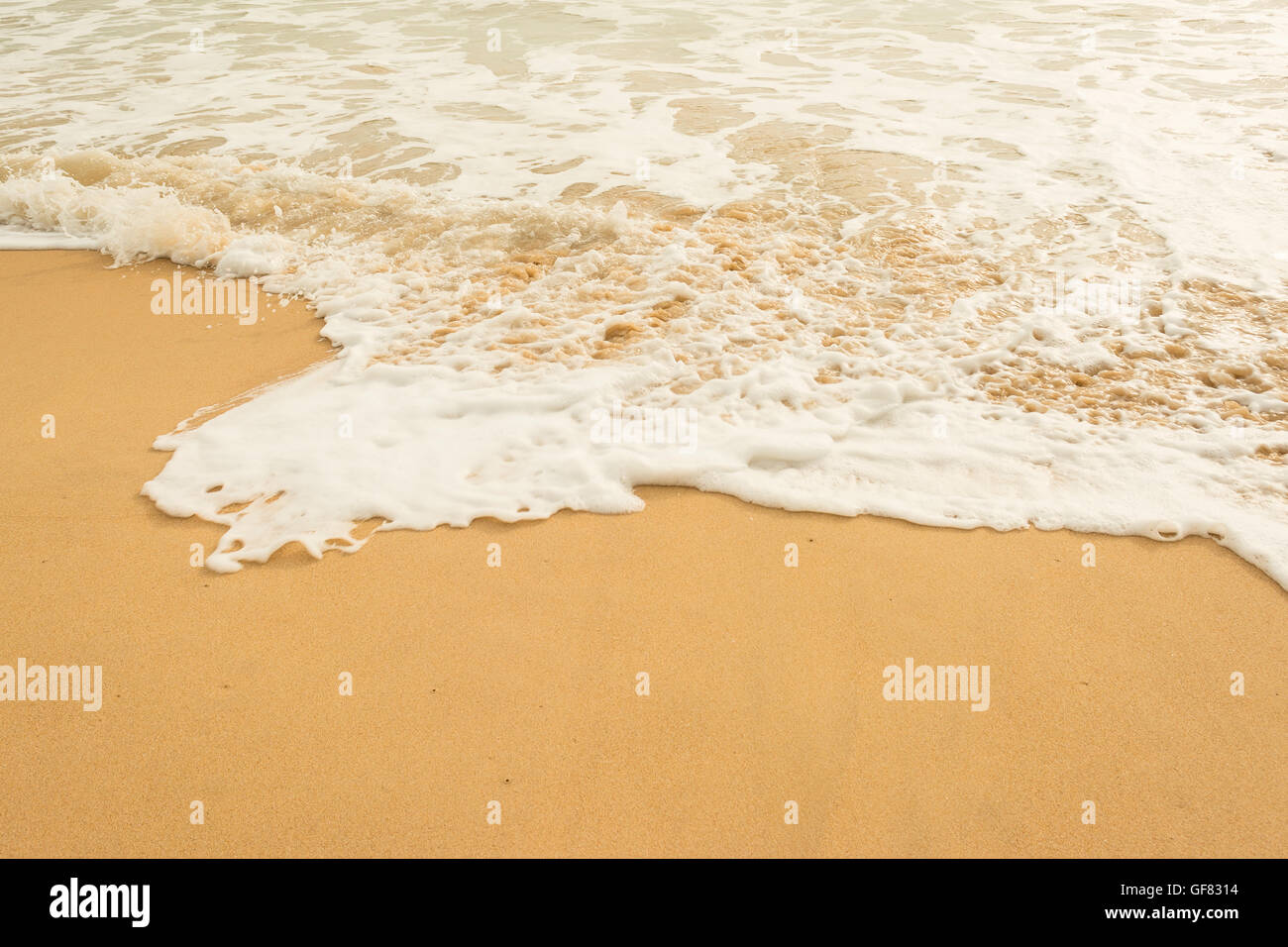 Sea wave and many foot print on the beach background Stock Photo - Alamy