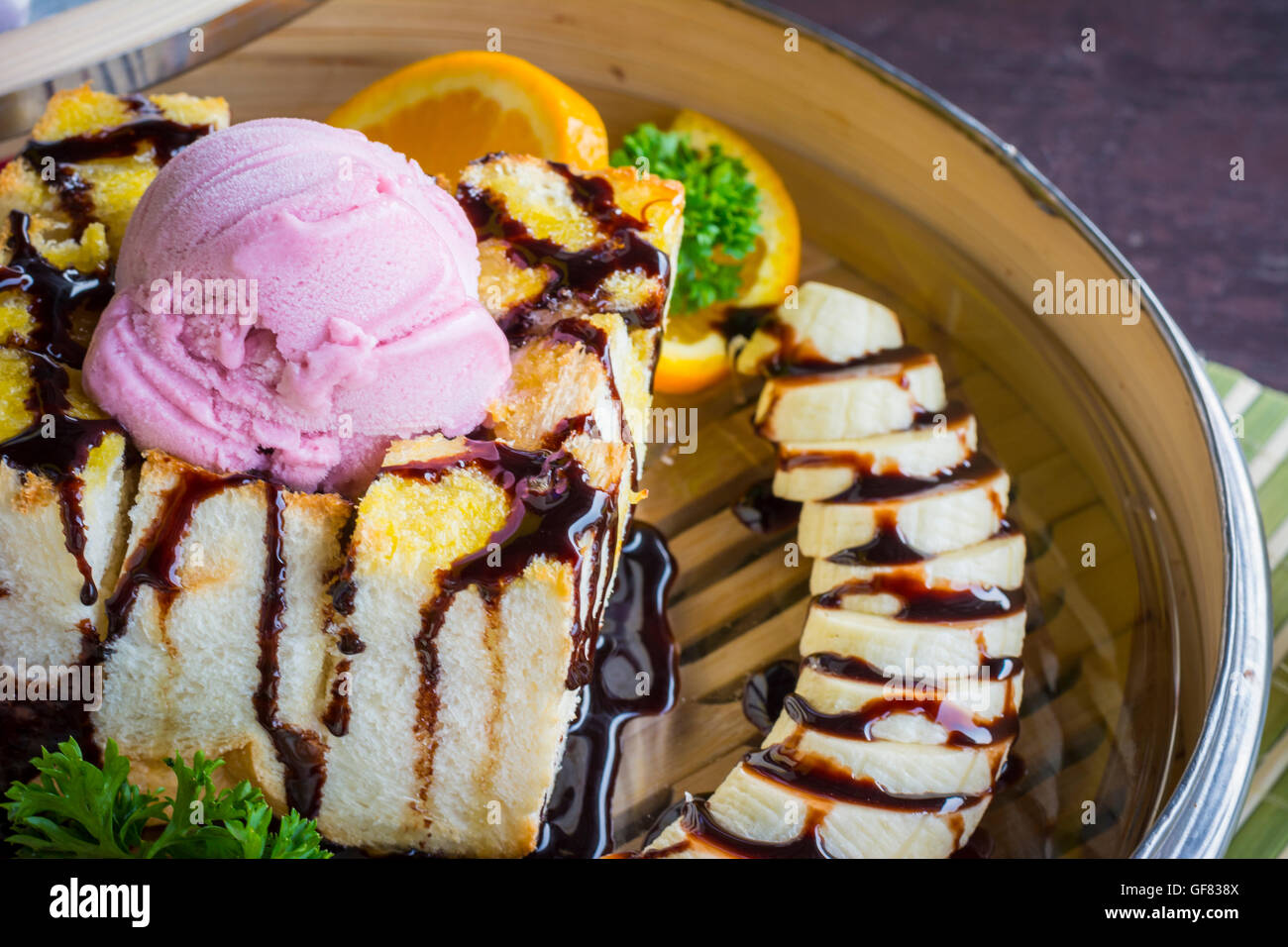 Honey toast and banana wtih dry ice on table background Stock Photo - Alamy