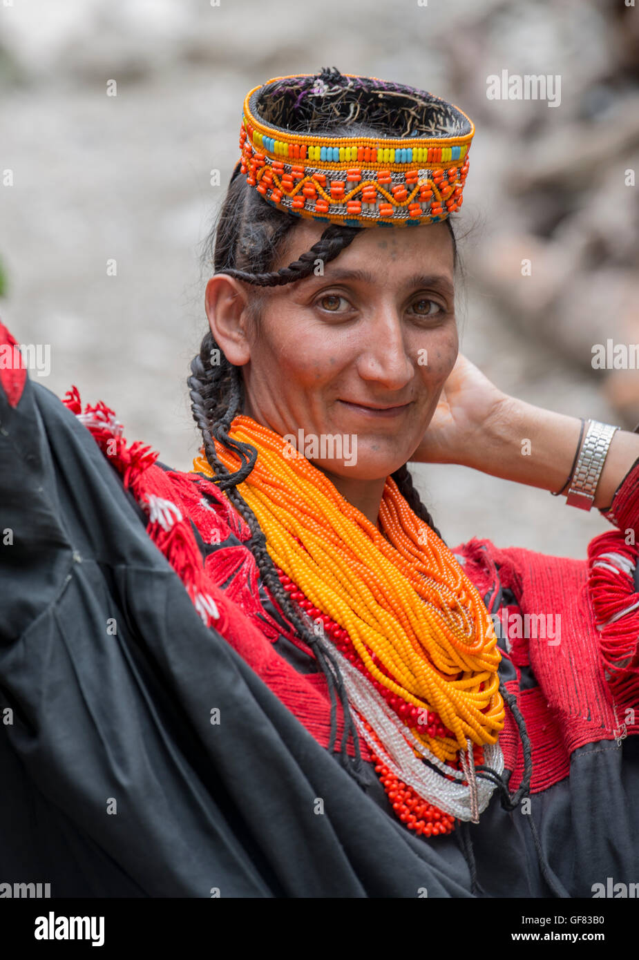 Kalash woman wearing traditional headdress, bead necklaces and ...