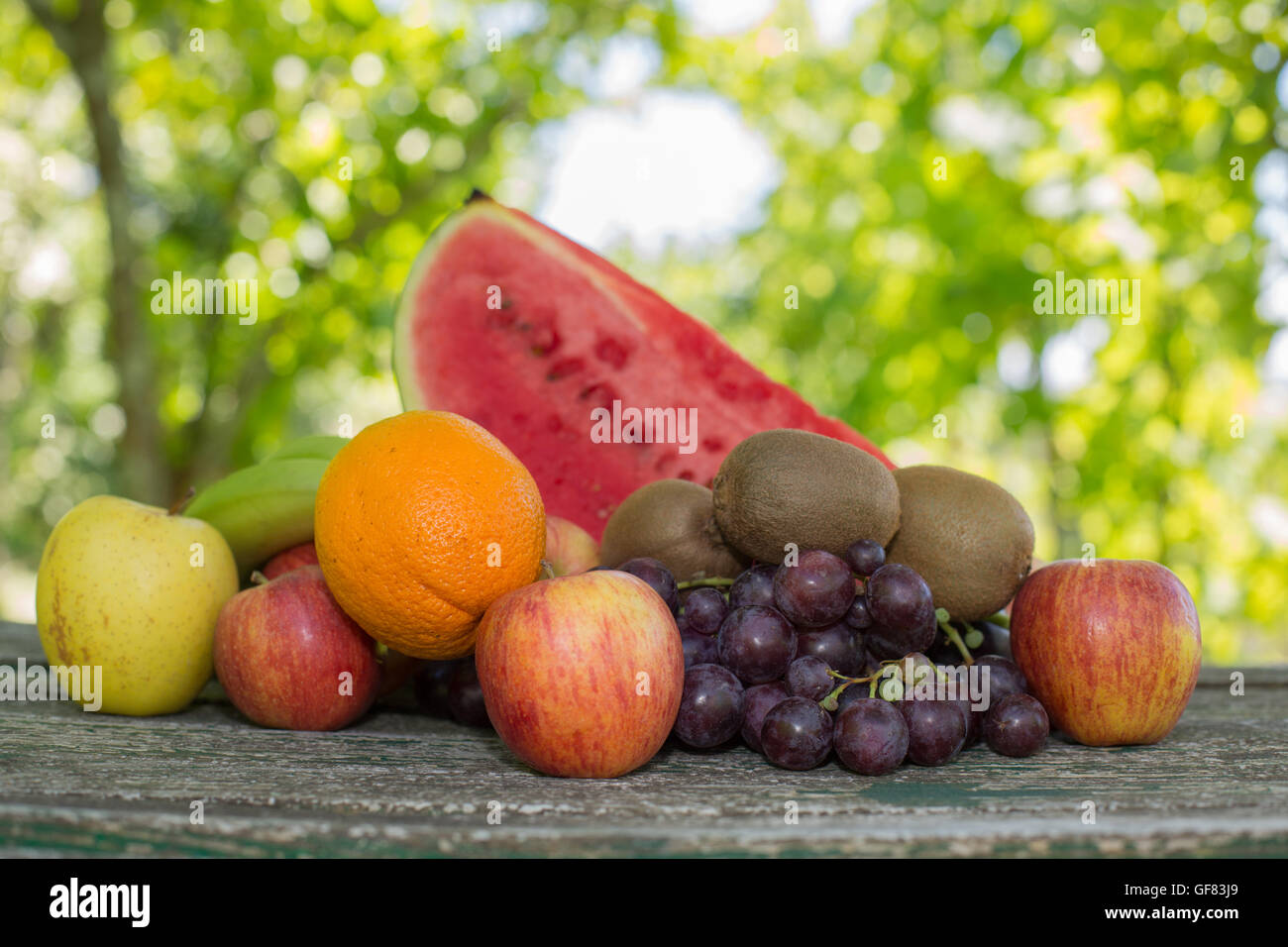 fruits in wooden table, outdoor Stock Photo - Alamy