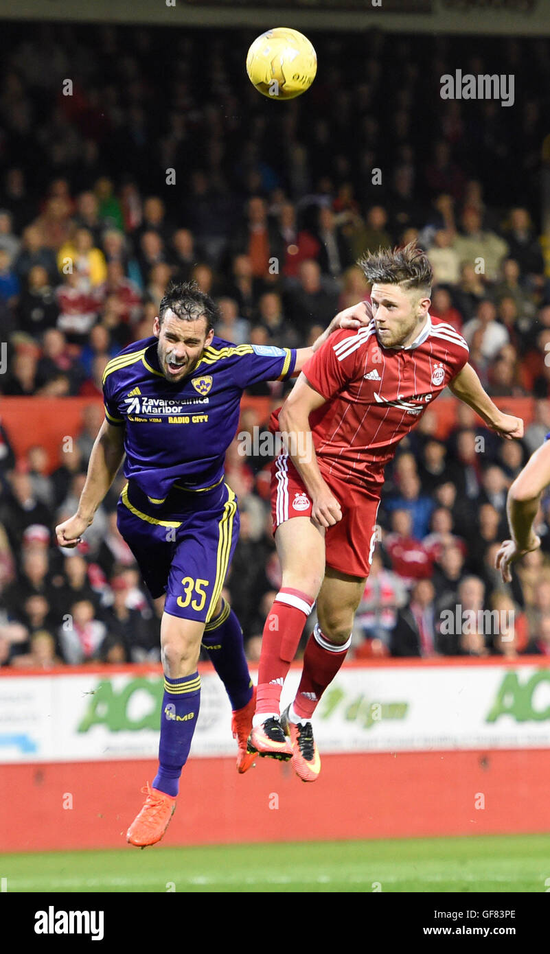 Aberdeen Wes Burns heads the ball as he is challenged by Maribor's ...