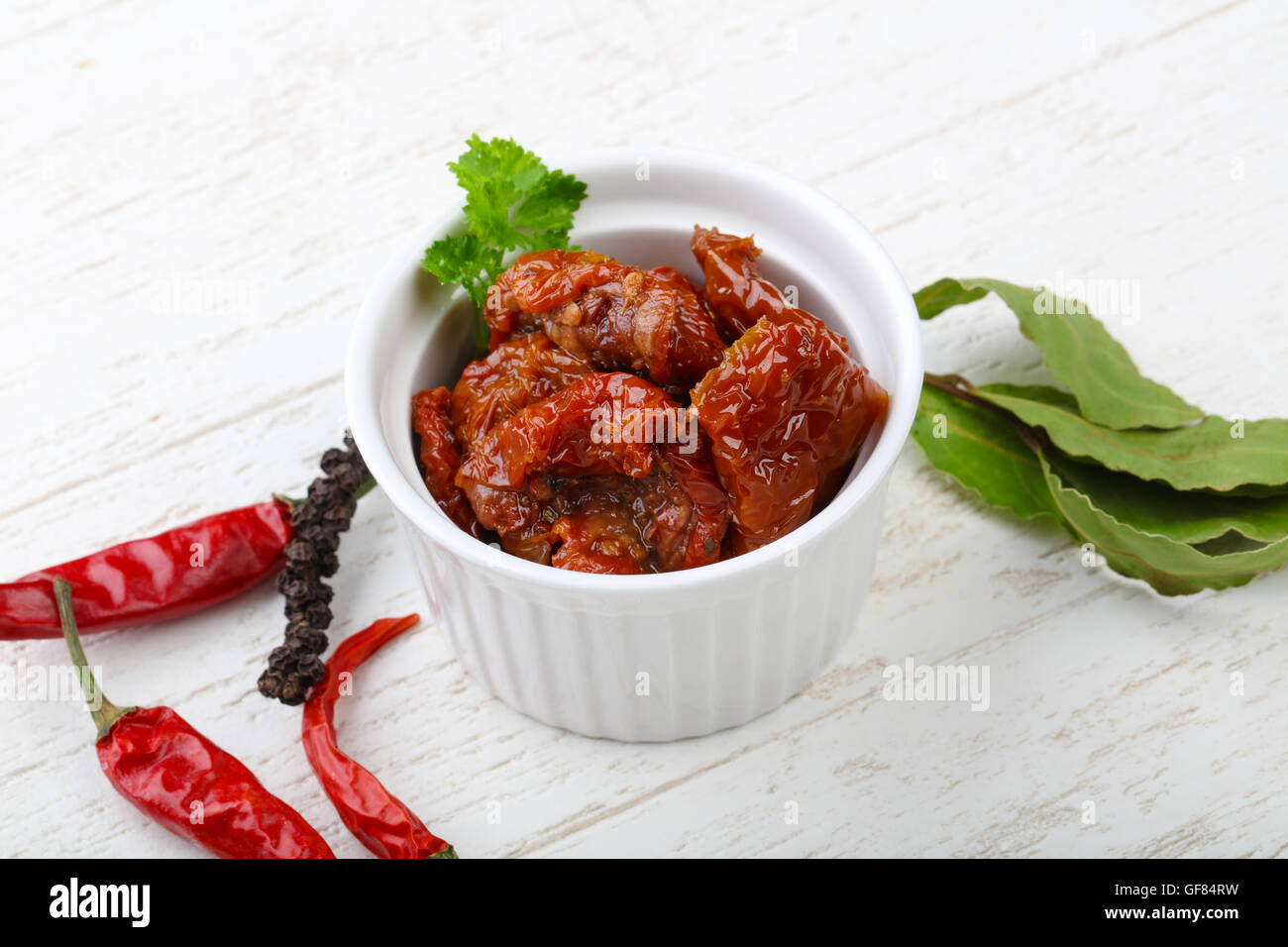 Dry tomato in olive oil with pepper Stock Photo - Alamy