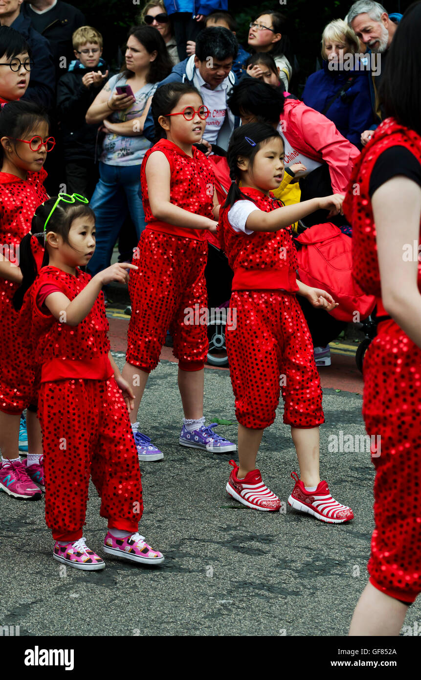 Chinese girls, dancers taking part in the Carnival Parade, part of the ... Chinese girls, dancers taking part in the Carnival Parade, part of the ...