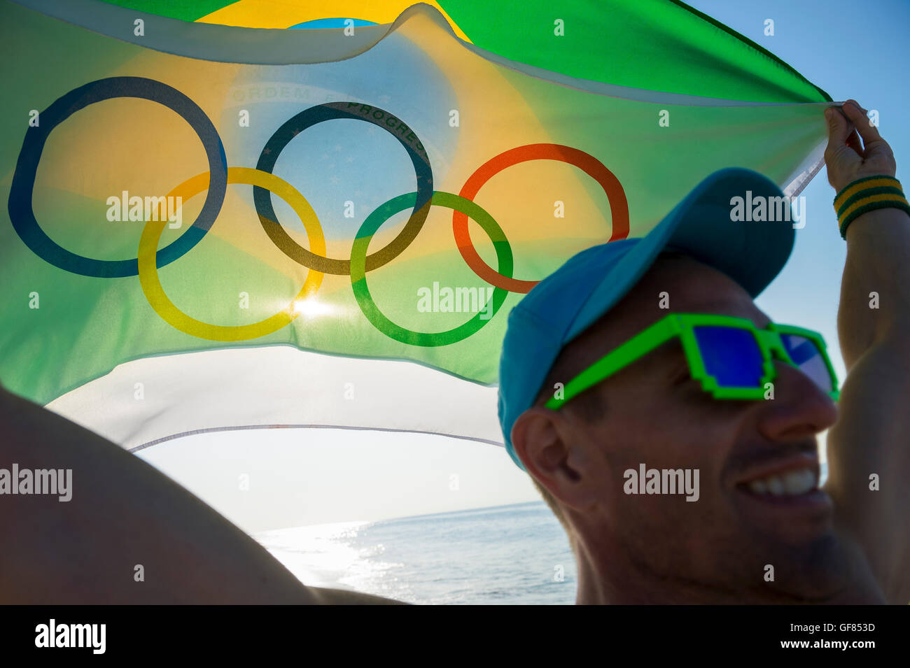 RIO DE JANEIRO - MARCH 10, 2016: Smiling athlete holds Olympic and ...