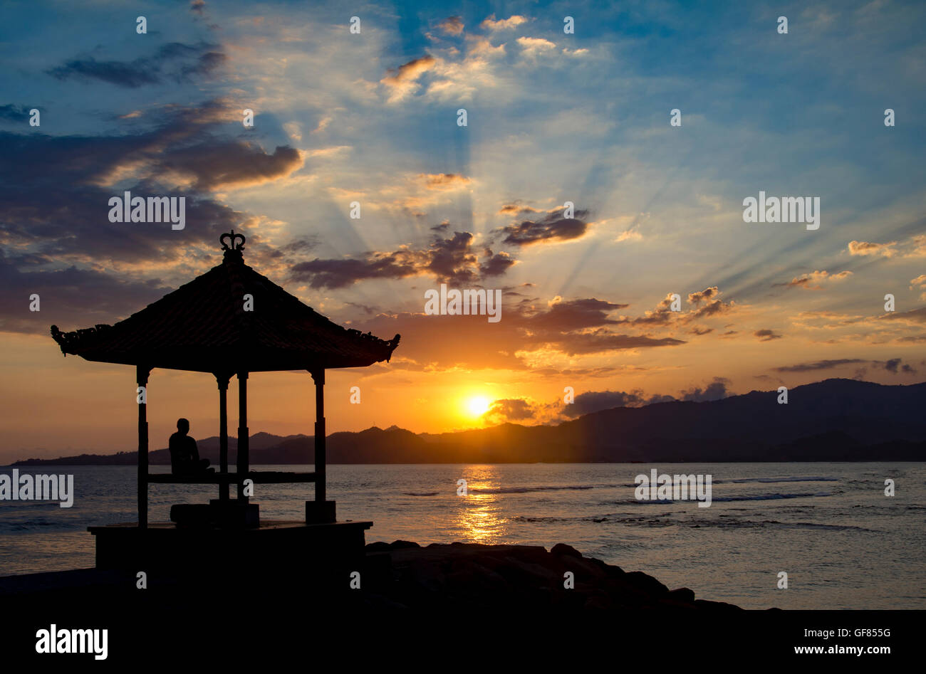 Prayers at Sunset, Bali, Indonesia Stock Photo - Alamy
