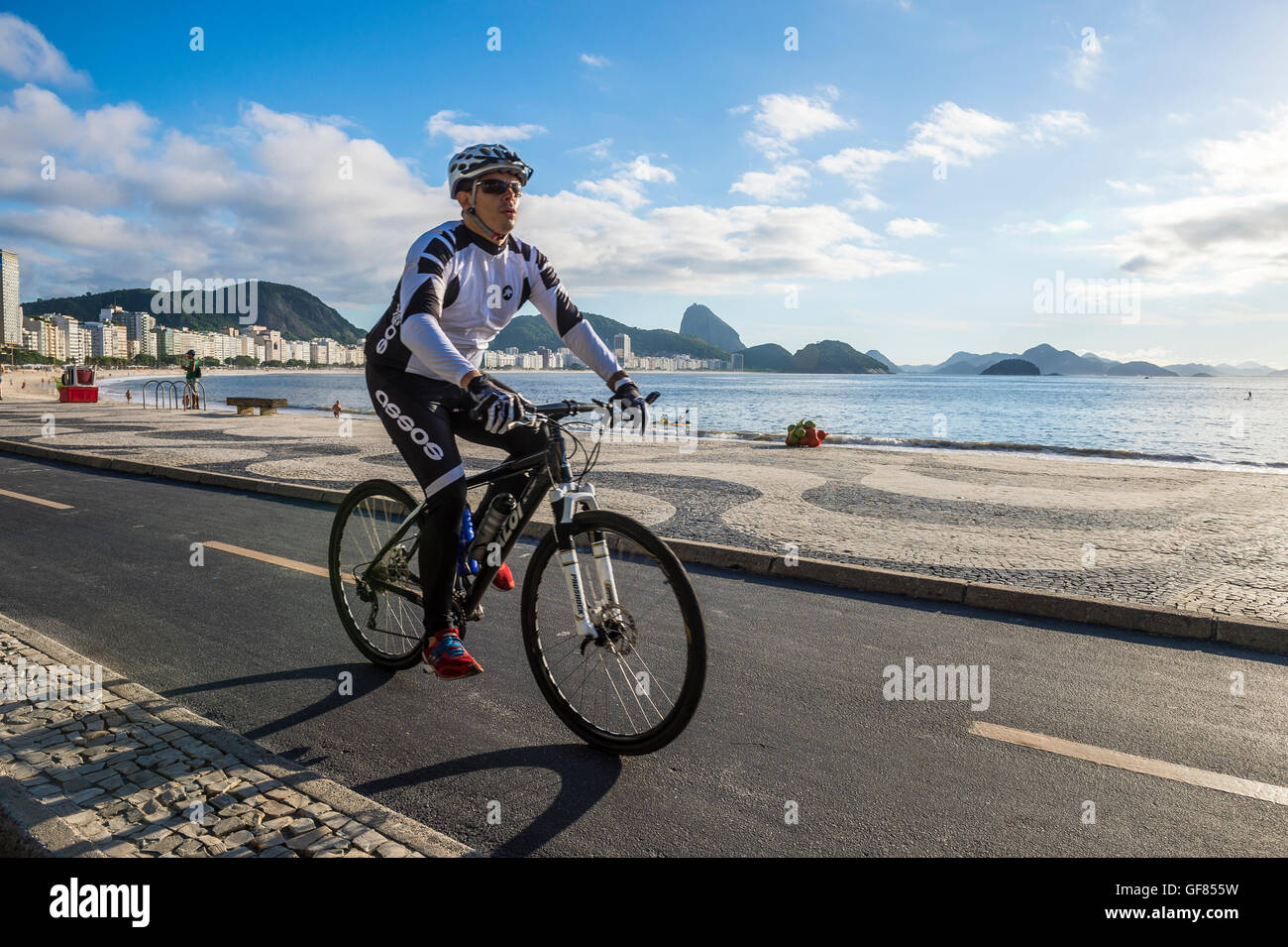 RIO DE JANEIRO - MARCH 20, 2016: Brazilians ride bicycles on the ...